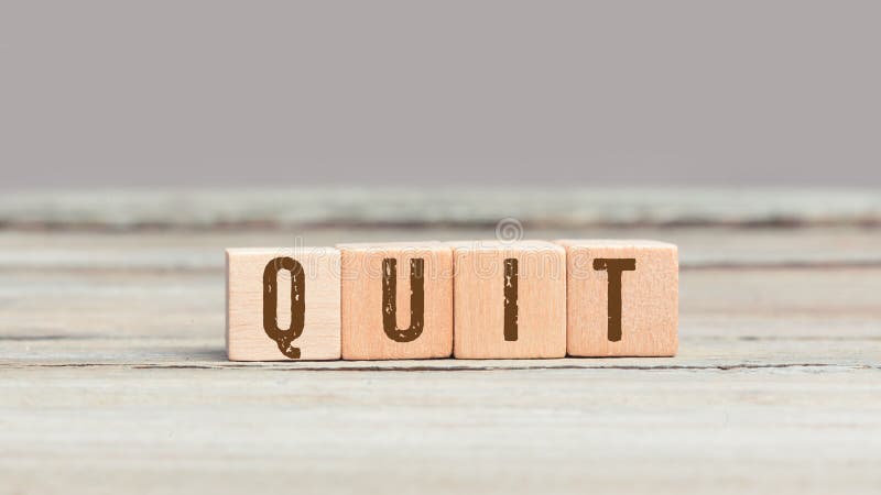 Word Quit on wood cubes stock photo. Image of cube, quit - 257133504
