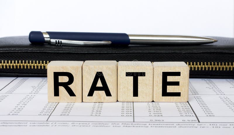 A Word Rate Written in a Wooden Cube with a Pen and Purse Stock Photo ...