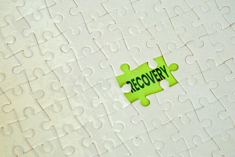 The Word Recovery Behind the Jigsaw Puzzle Pieces Stock Photo - Image ...
