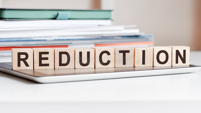 The Word Reduction is Written on Wooden Cubes, Concept Stock Image ...