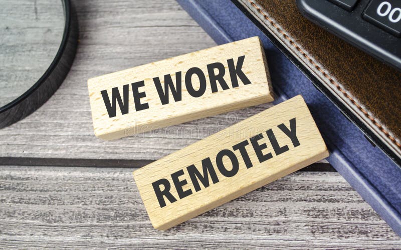 We Word Remotely . Text on Wooden Blocks on Wooden Background with ...