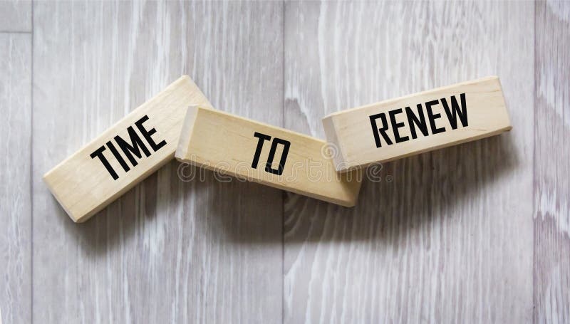 The Word RENEWAL TIME is Written on Wooden Blocks on a Gray Table Stock ...