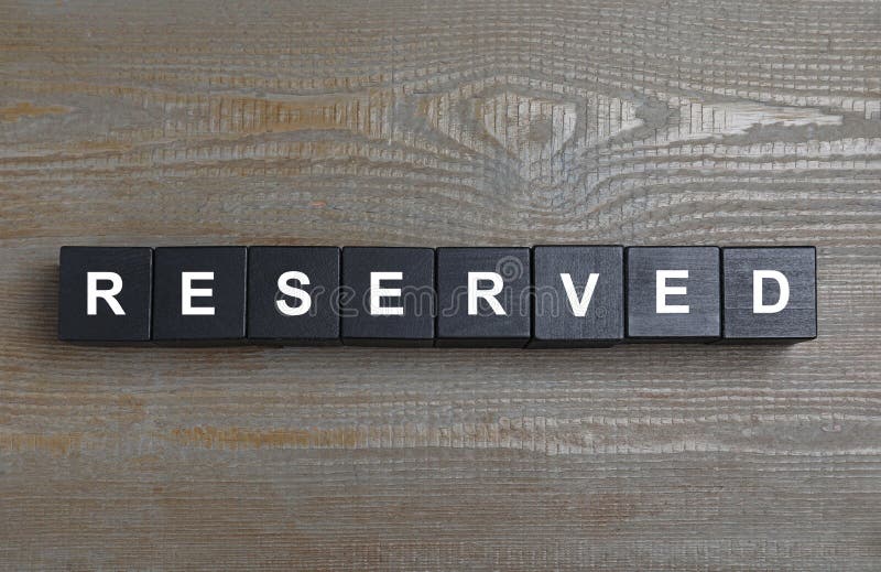 Word RESERVED Made with Cubes on Wooden Surface, Top View. Table ...