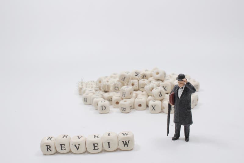 A Word REVIEW on Wooden Cube Block with Figure Stock Photo - Image of ...