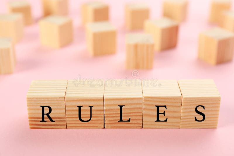 Word Rules Made of Wooden Cubes with Letters on Light Blue Background ...