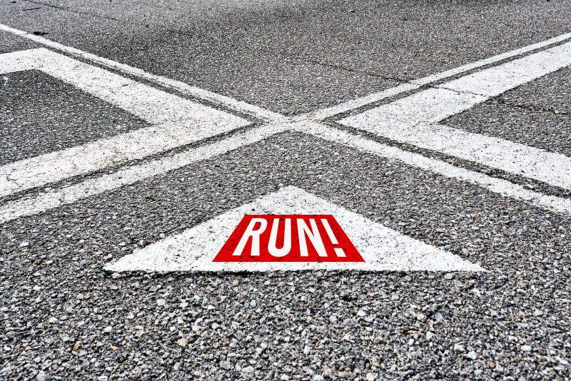 The Word Run Written on Asphalt Surface with Direction Arrow Stock ...