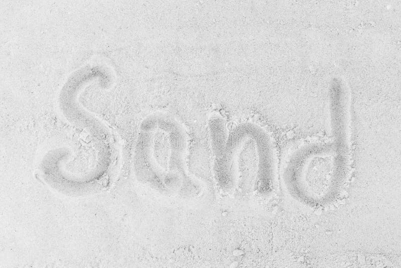 The Word Sand is Written on a White Beach Sand Background. Sign or ...