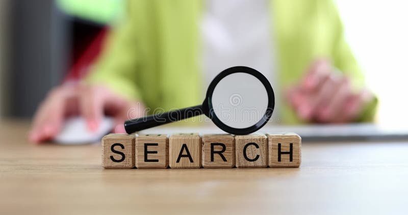 Word Search with Magnifying Glass on Table and Computer Work Stock ...