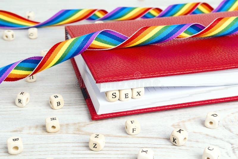 Word Sex Written In Wooden Blocks In Red Notebook With Rainbow Lgbt