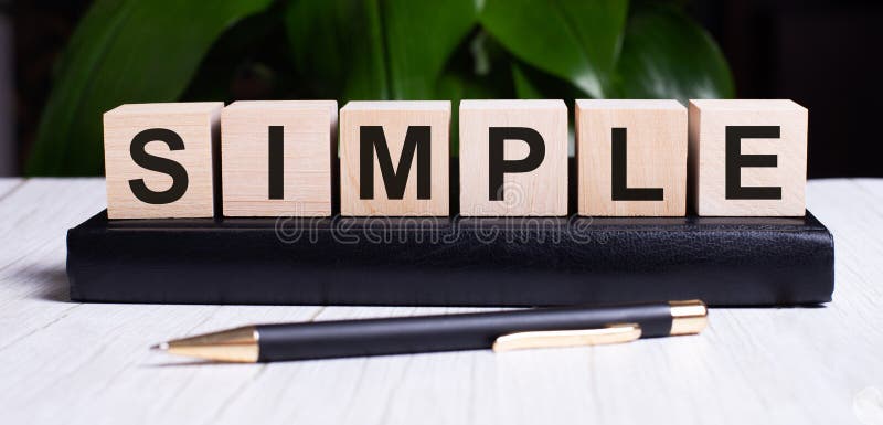 The Word SIMPLE is Written on the Wooden Cubes of the Diary Near the ...