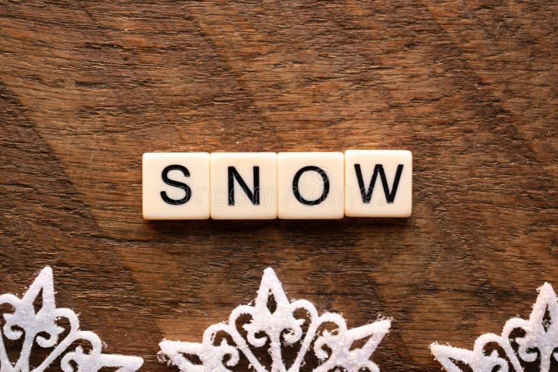 The word SNOW on wood stock photo. Image of scrabble - 166211800