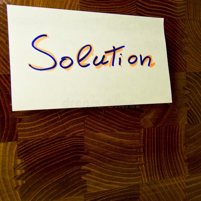 Word Solution Written on a Yellow Postit Attached on a Wood Panel - for ...