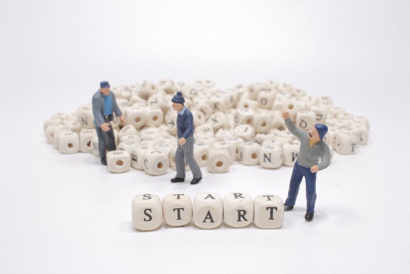 A Word Start on Wooden Cube Block with Figure Stock Image - Image of ...