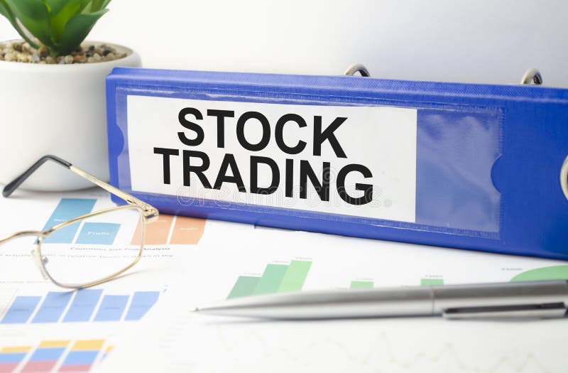 Word Stock Trading on Blue Folder and Charts Stock Photo - Image of ...