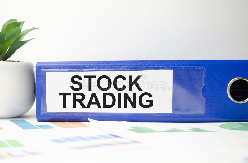 Word Stock Trading on Blue Folder and Charts Stock Image - Image of ...