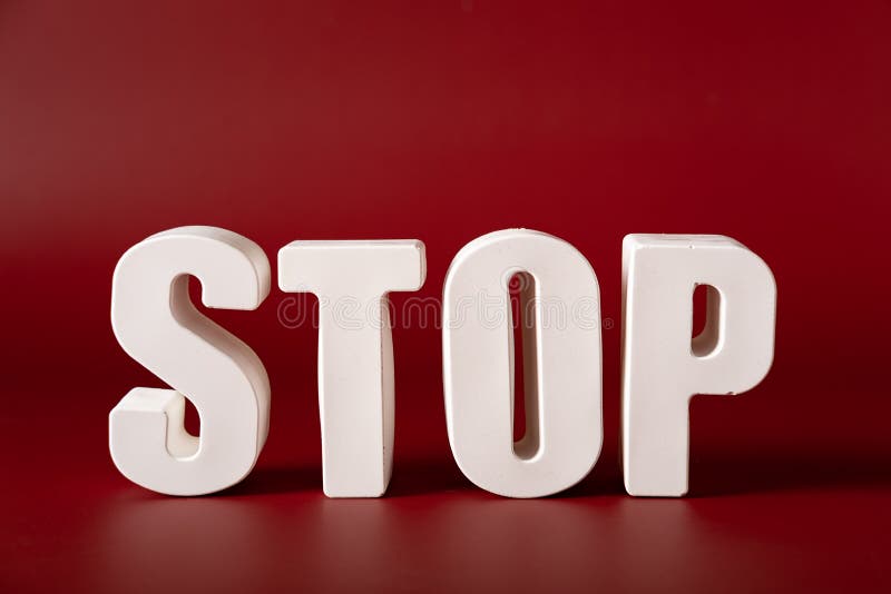 Word Stop Made from White Concrete Letters on the Red Background Stock ...