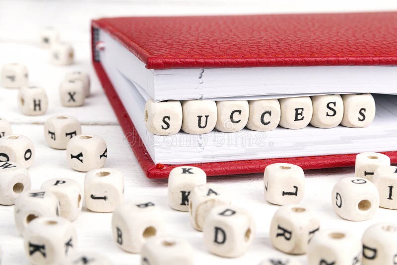 Word Success Written in Wooden Blocks in Red Notebook on White W Stock ...