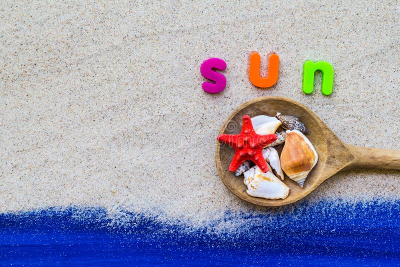 Word Sun Laid Sand Blue Board Stock Photo - Image of scallop, natural ...