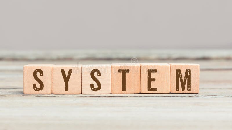 Word System on wood cubes stock photo. Image of headline - 252512928