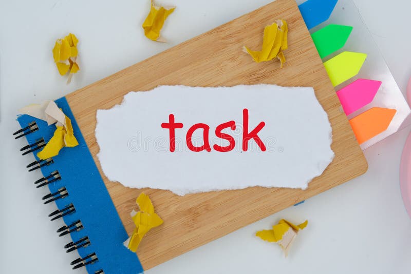 The Word Task is Written on a Torn Piece of Paper on a Notepad. the ...