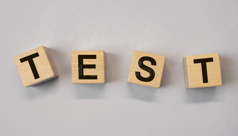 Word TEST on Wood Cubes on Green Background Stock Image - Image of ...