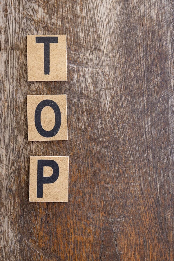 The Word Top Written in Small Wooden Blocks on a Rustic Background ...
