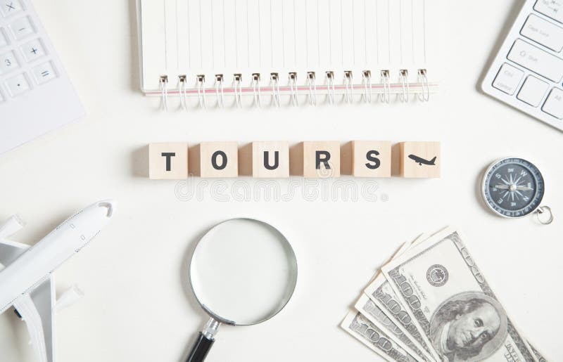 Word Tours on Wooden Cubes with a Travel Objects Stock Image - Image of ...