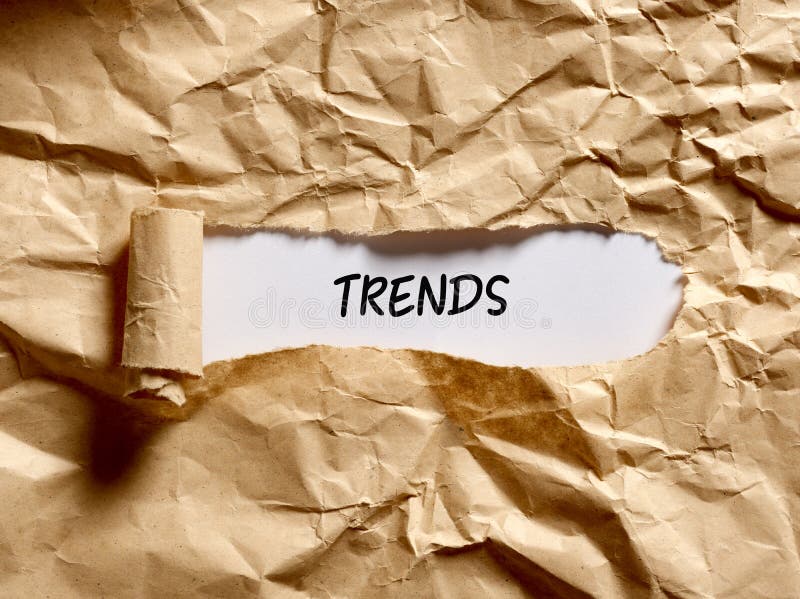 The Word Trends Written Under a Brown Torn Paper. Discovering the ...