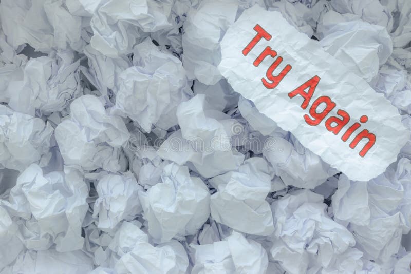 The Word TRY AGAIN is Placed on the Background Paper in the Big Trash ...