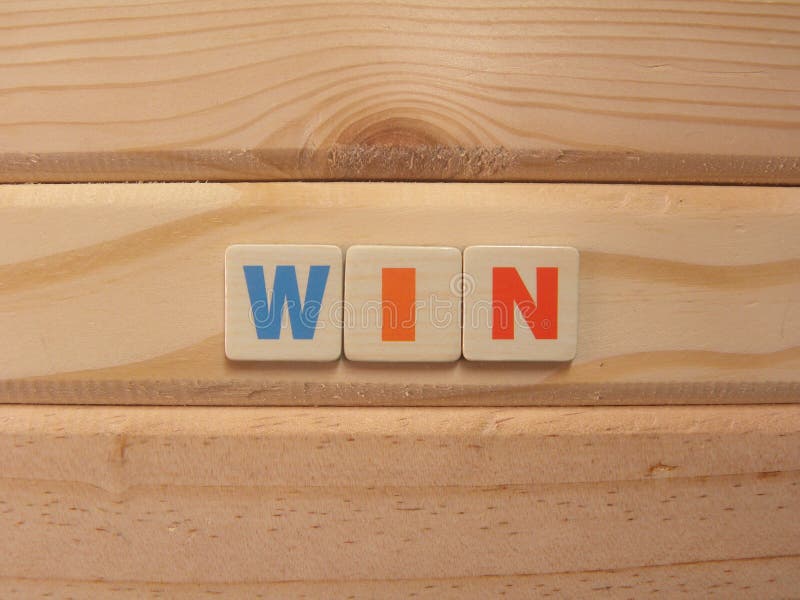 Word Win on wood stock image. Image of colors, characters - 164646277