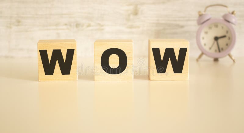 The Word WOW Consists of Wooden Cubes with Letters, Top View on a Light ...