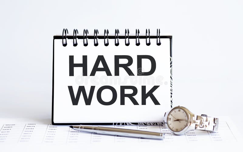 HARD WORK AHEAD Text on a Blue Pieces of Paper on Yellow Background ...