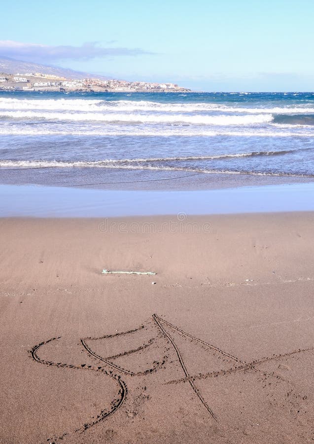 Word Written on the Sand stock photo. Image of tropical - 221173086