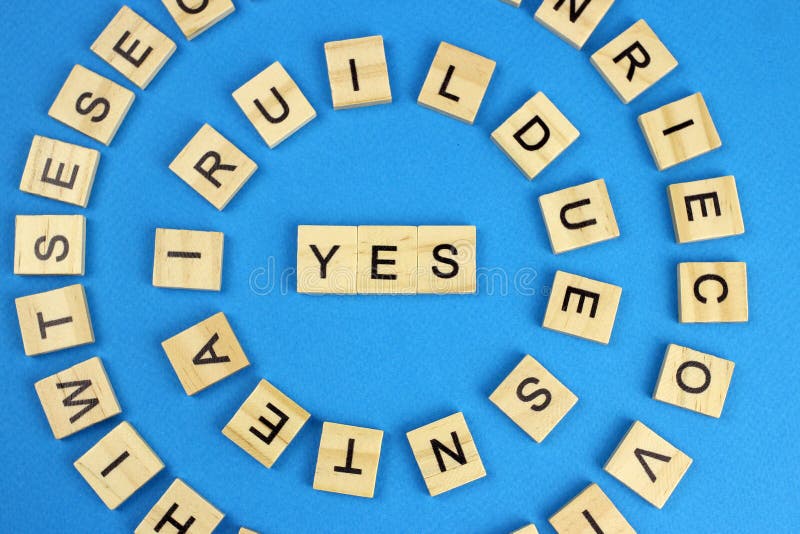 Word Yes is Made of Wooden Letters on a Blue Background Stock Image ...