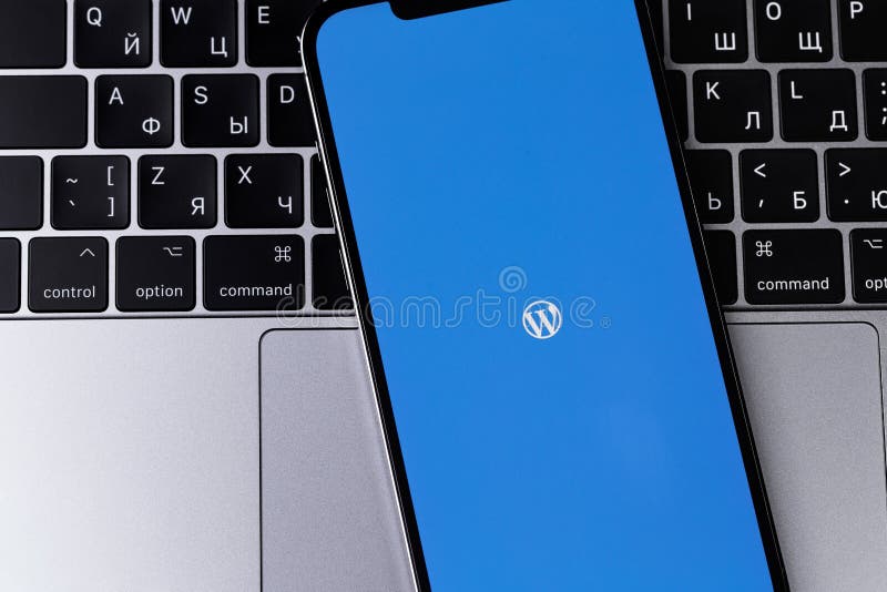 WordPress Logo Mobile App on Screen Smartphone IPhone with Macbook ...