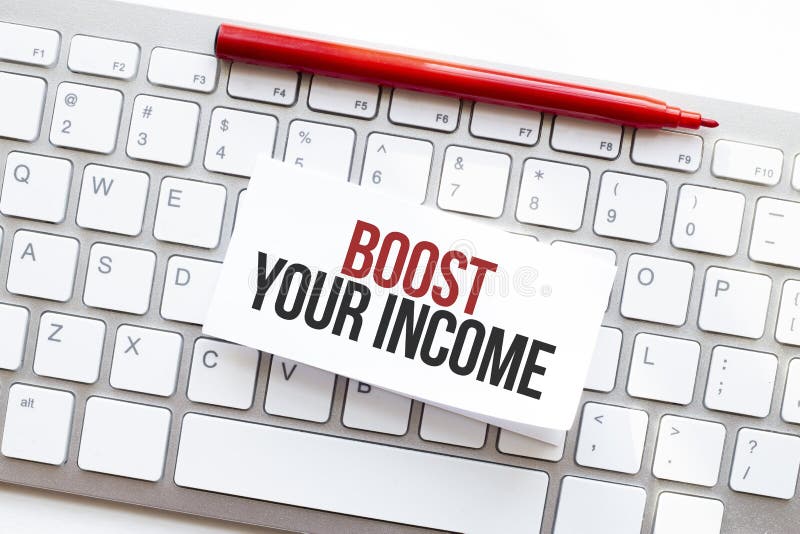 Words Boost Your Income Written on Torn Paper on a Computer Keyboard ...