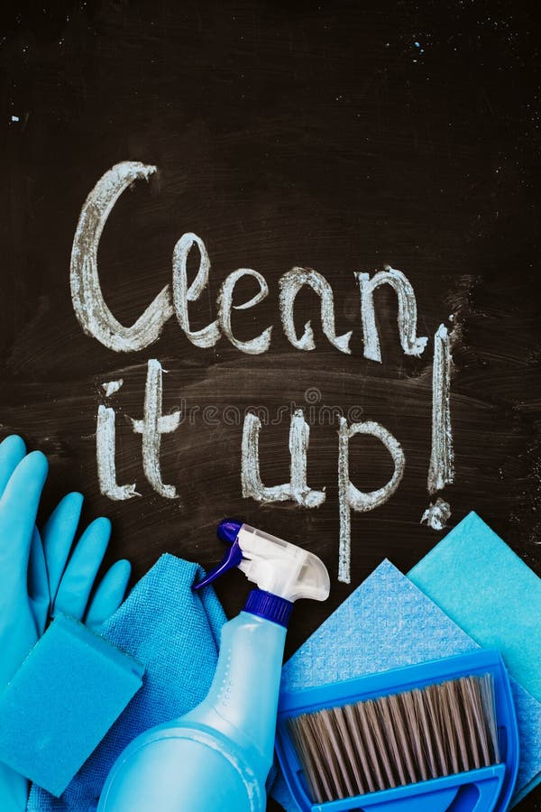 The Words ` Clean it Up! `written in Chalk on a Blackboard Over Blue ...