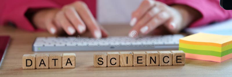 Words Data Science on Wooden Cubes and Female Scientist Working with ...