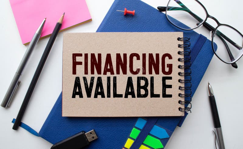 Words FINANCING AVAILABLE Written on Torn Paper on a Computer Keyboard ...