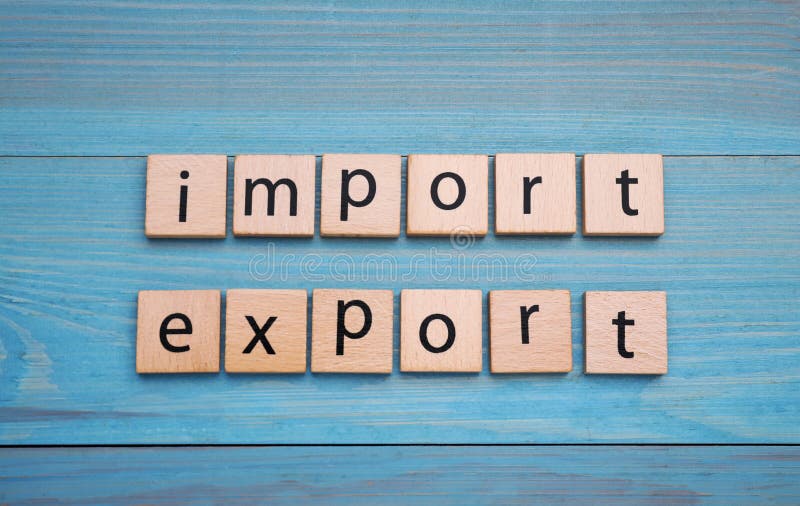 Words Import and Export Made of Cubes on Light Blue Wooden Table, Top ...