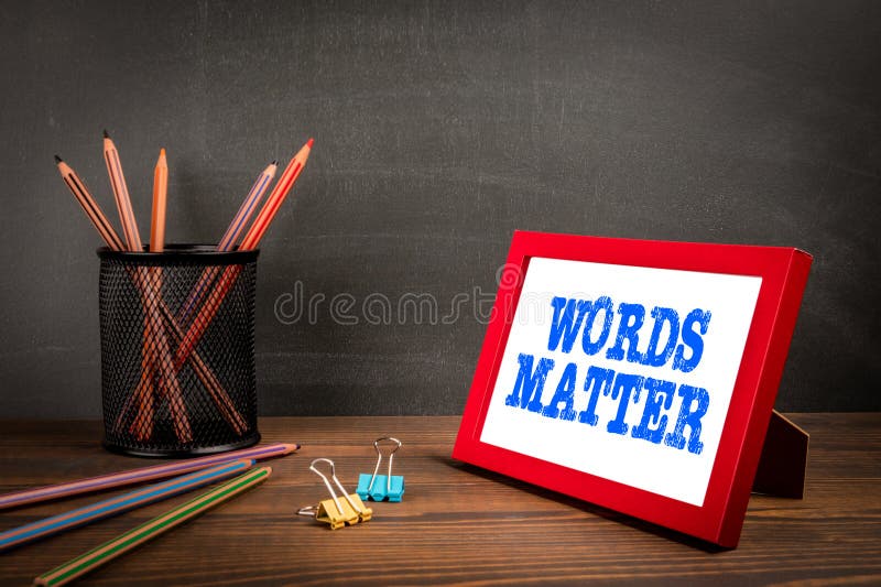 WORDS MATTER. Red Picture Frame with Text on Wood Texture Background ...