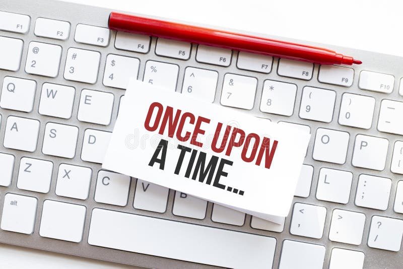 Words ONCE upon a TIMe Written on Torn Paper on a Computer Keyboard ...