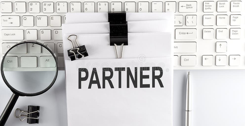 Words PARTNER Written on Papers on a Computer Keyboard with Magnifier ...