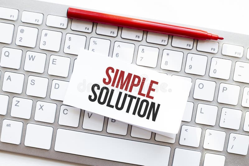 Words SIMPLE SOLUTION Written on Torn Paper on a Computer Keyboard ...