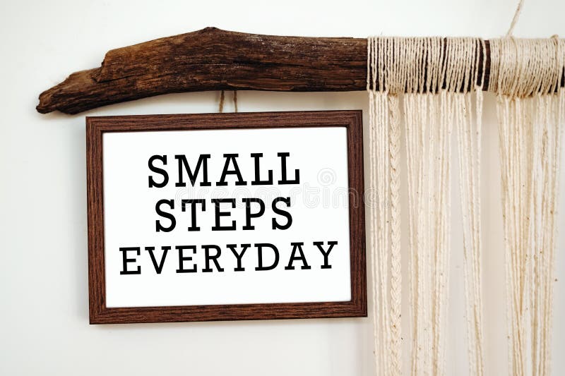 The Words Small Steps Everyday Written on a White Paper. Motivation ...