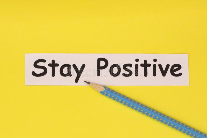 The Words Stay Positive on a Yellow Background. Motivational Concept ...