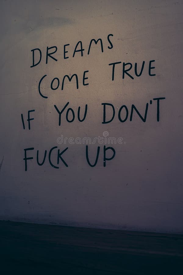 Saying about Dreams in Black Letters on a White Wall Stock Image ...