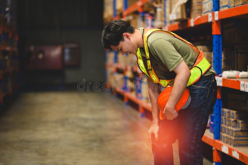 Work Accidents Concept. Warehouse Worker Has Knee Pain from Working ...