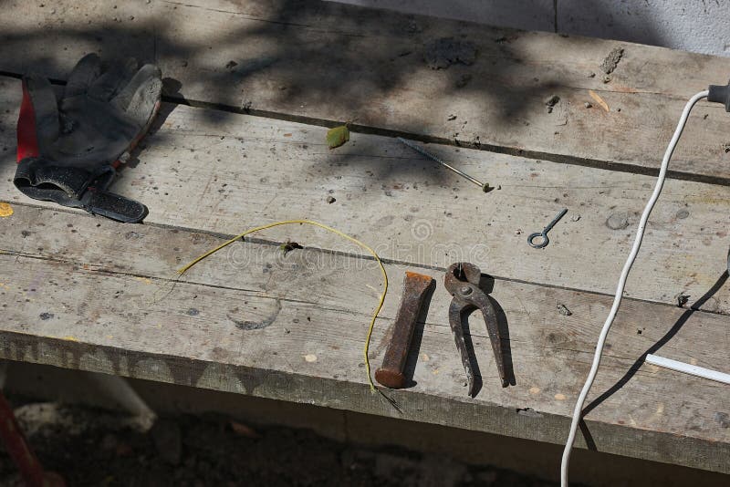 Work bench with some tools stock photo. Image of leftover - 375297438