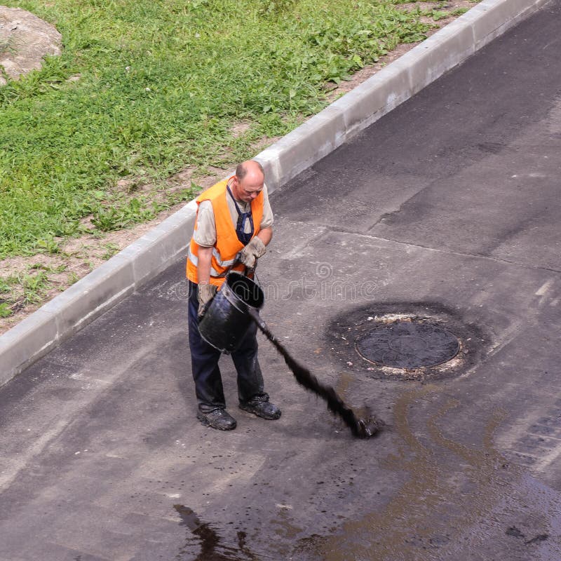 Work Bitumen Pouring from a Bucket. Editorial Photography - Image of ...